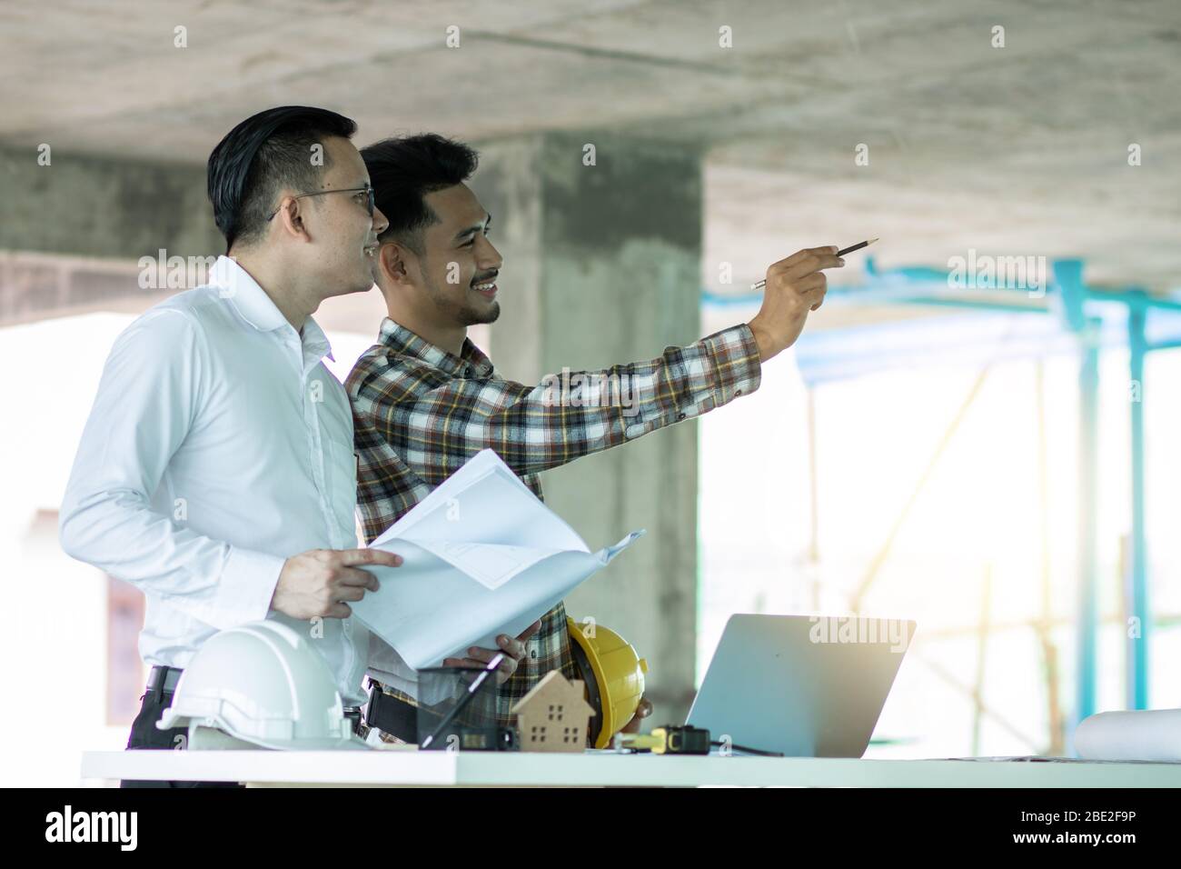Engineer and inspector checking work in site Stock Photo - Alamy
