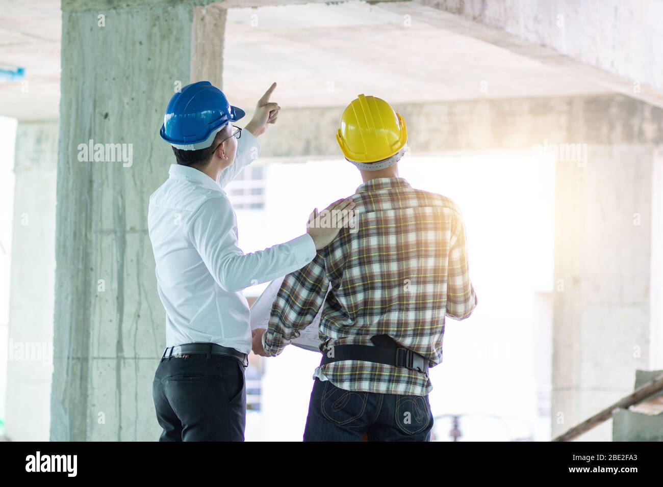 Engineer and inspector checking work in site Stock Photo - Alamy