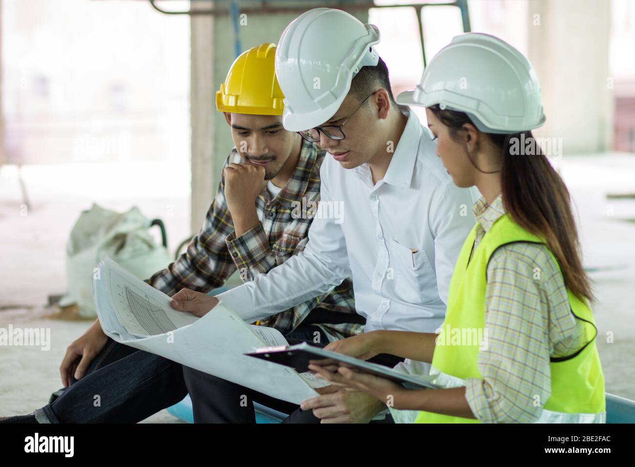 Team of engineer planning and checking project on blue print Stock ...