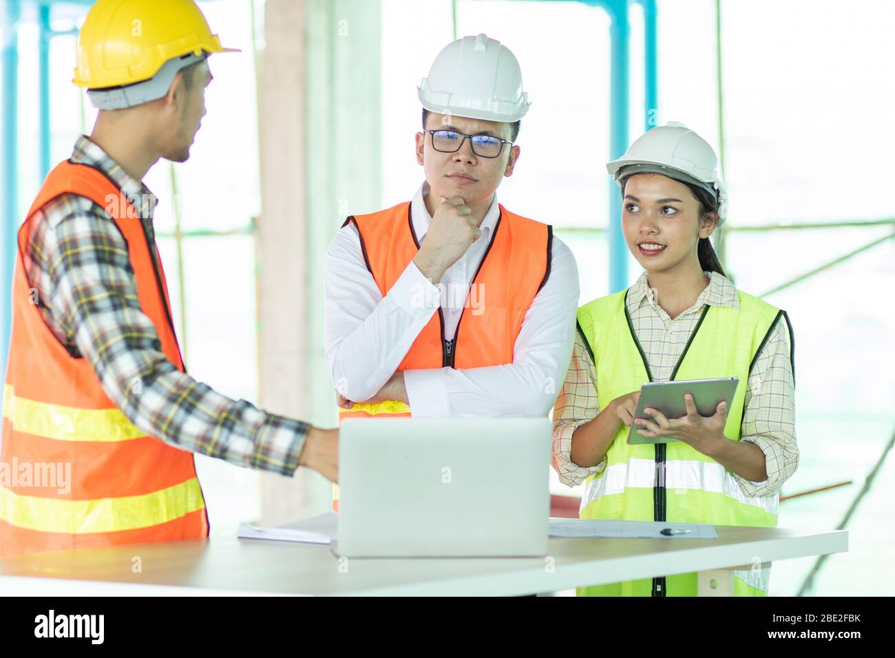 professional engineer planning with team young architect with laptop on ...
