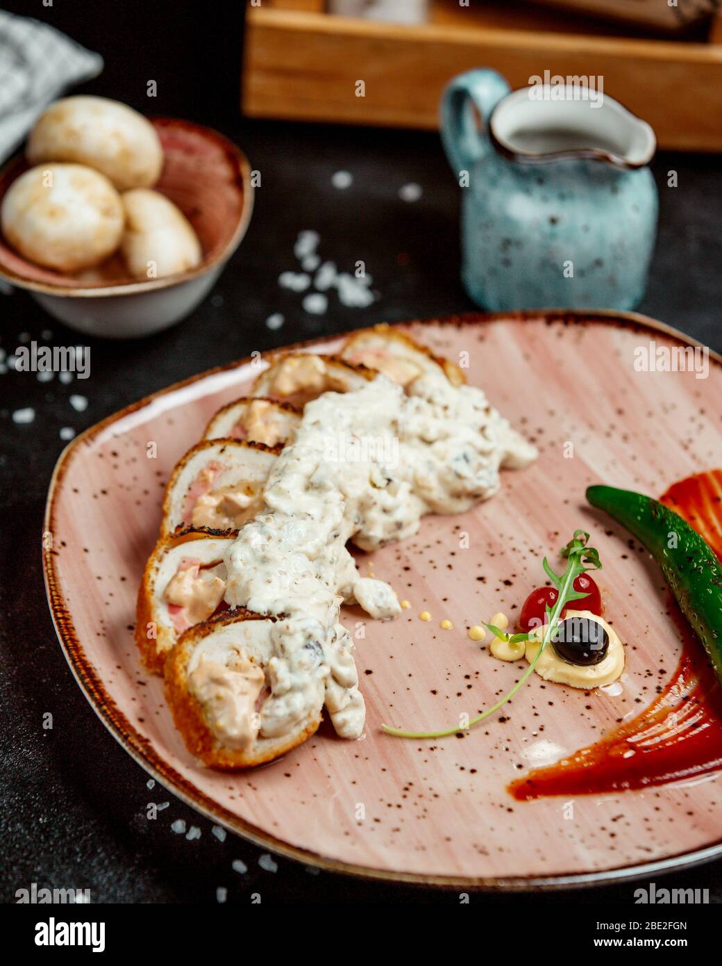 crispy fried chicken rolls garnished with creamy mushroom Stock Photo ...