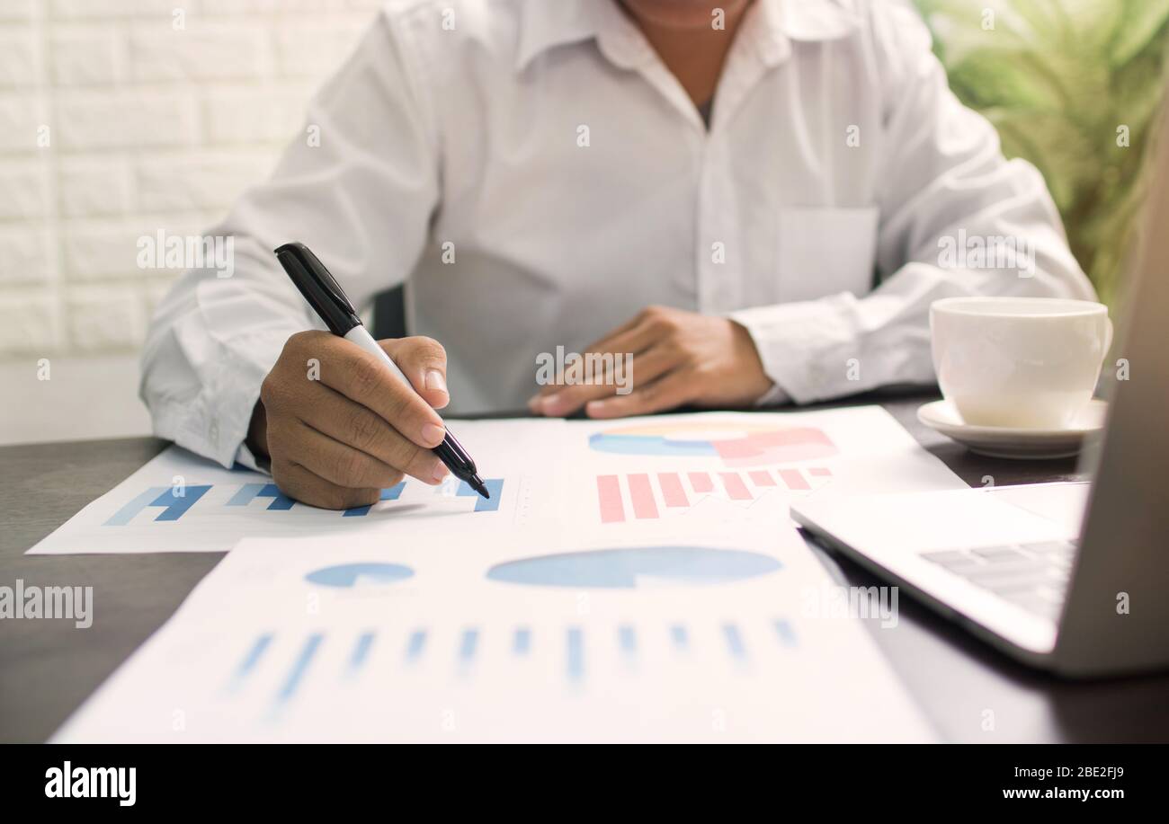 Checking banker hi-res stock photography and images - Alamy