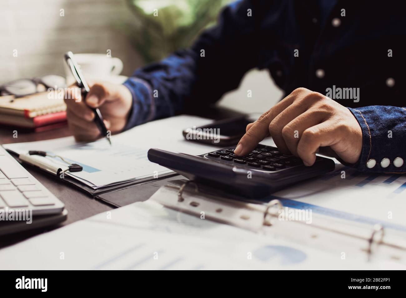 business man checking on financial paper Stock Photo - Alamy