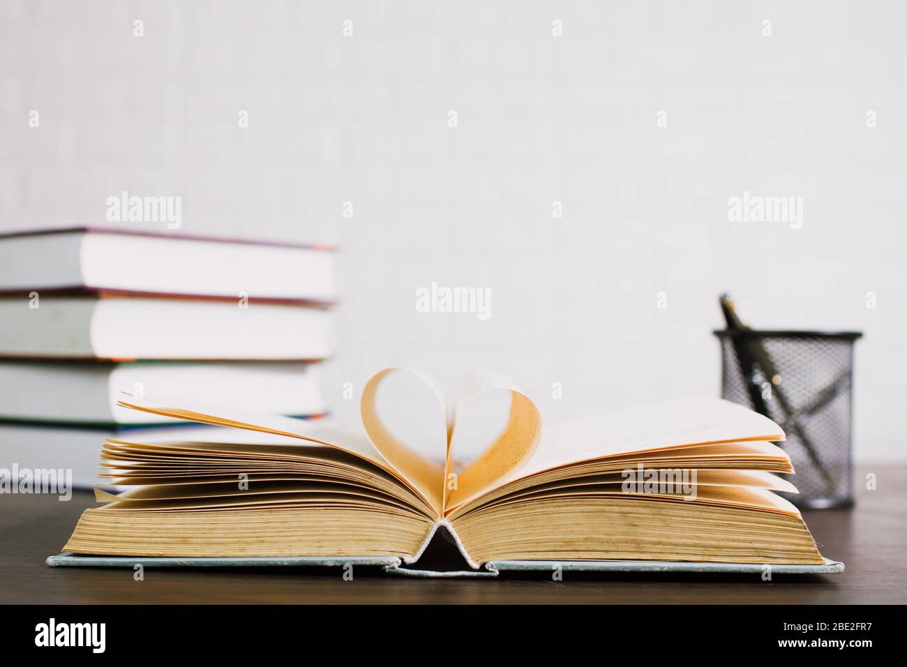 open book on desk, knowledge and education concept Stock Photo - Alamy