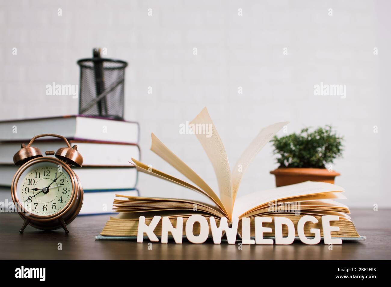 open book on desk, knowledge and education concept Stock Photo - Alamy
