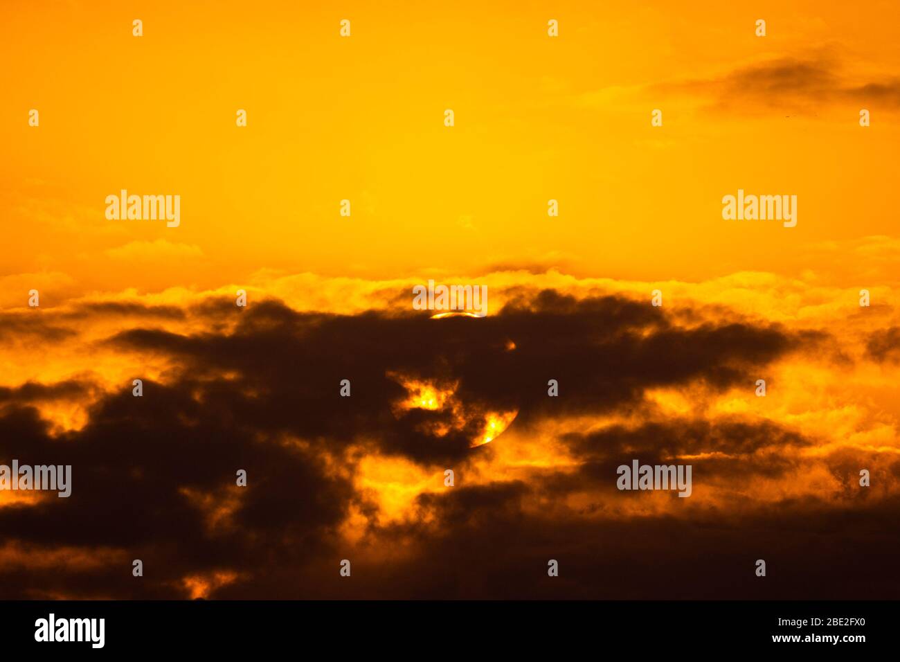 Beautiful sunset with the clouds covering the sun. Very big sun Stock ...