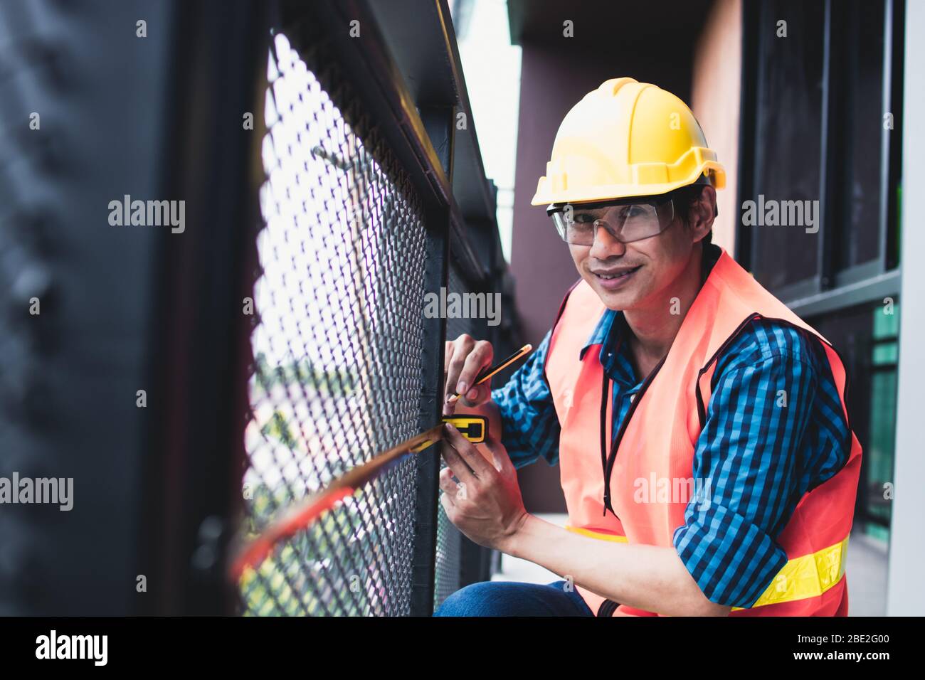 inspector checking and measuring tape measure in building Stock Photo ...