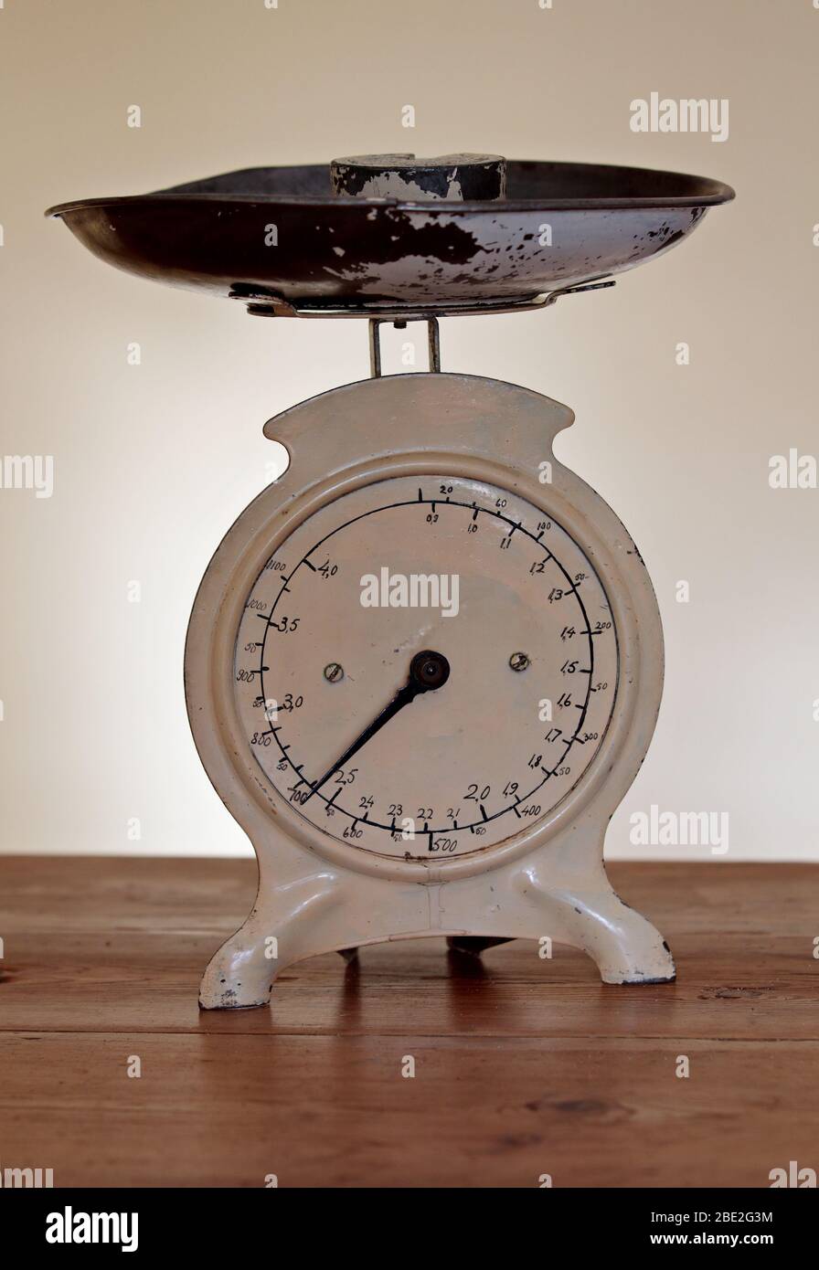 An old white scale made of iron with handwritten numbers Stock Photo ...