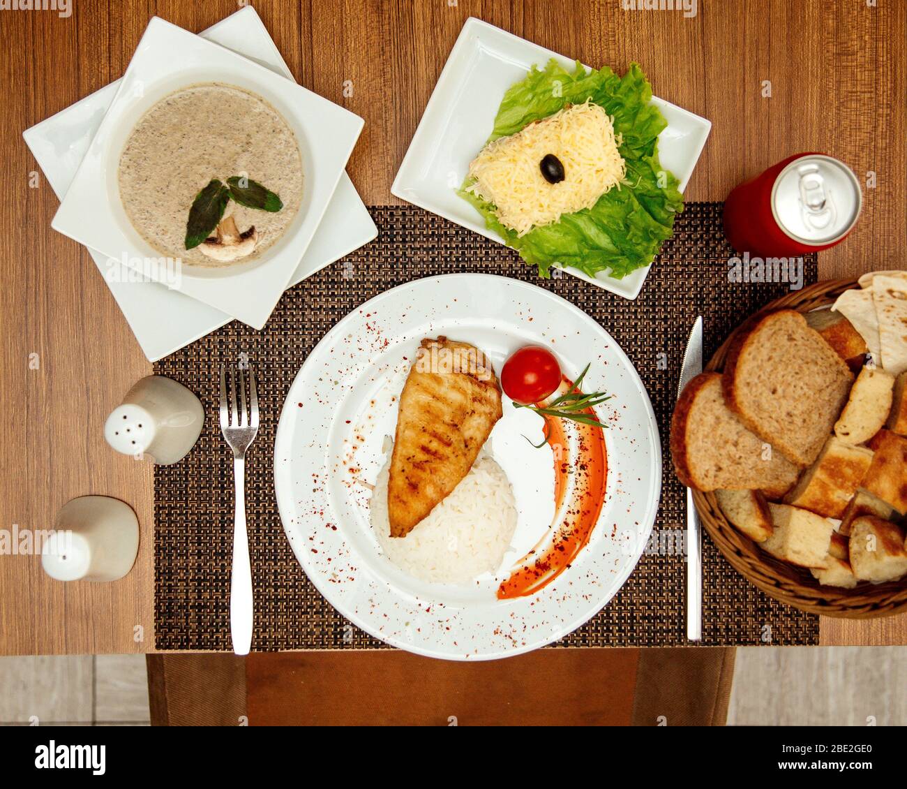 lunch setup with chicken and rice mimosa salad and mushroom soup Stock ...
