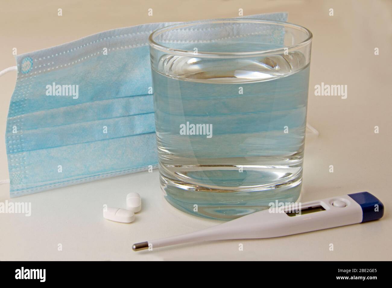 Face mask, headache tablets, water and thermometer, coronavirus Stock ...