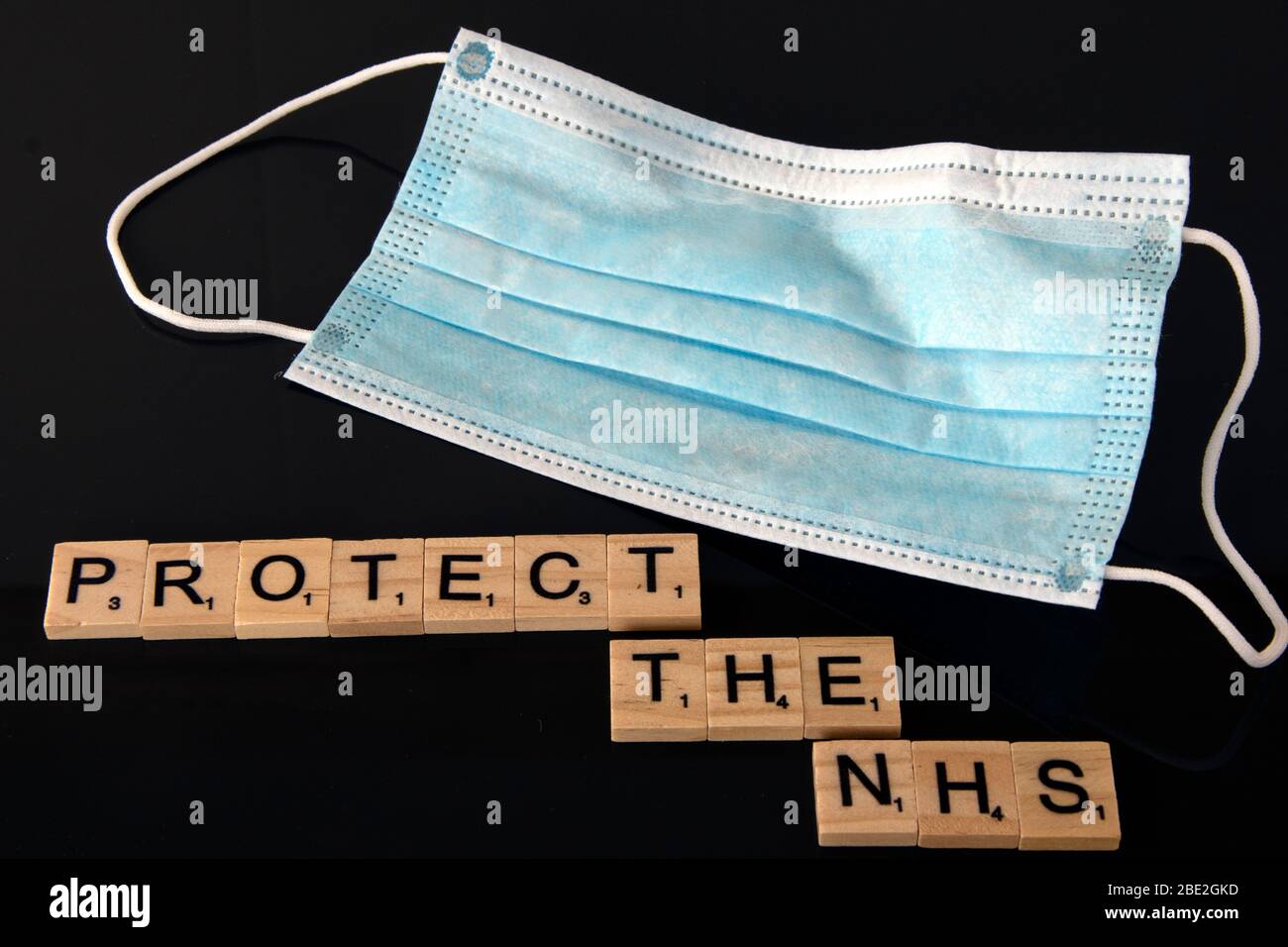 Coronavirus pandemic, mask with PROTECT THE NHS in words Stock Photo ...