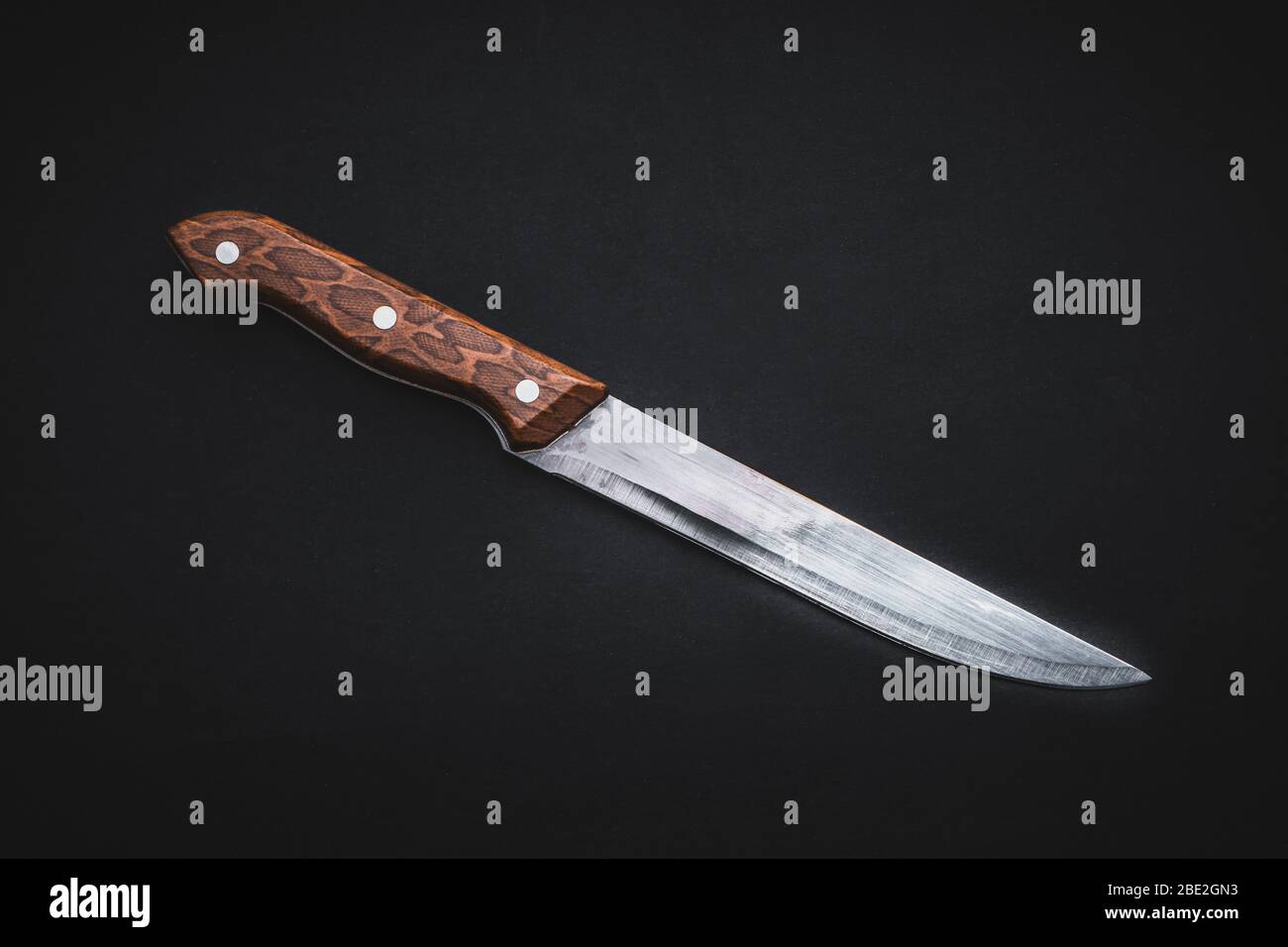 Kitchen knife on black background. Selective focus Stock Photo - Alamy