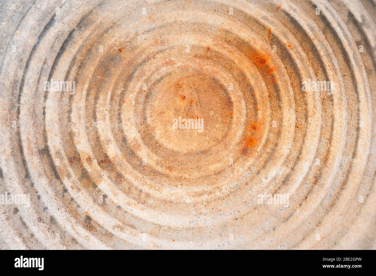 Textured grunge background of circle pattern with rust stains in a full ...