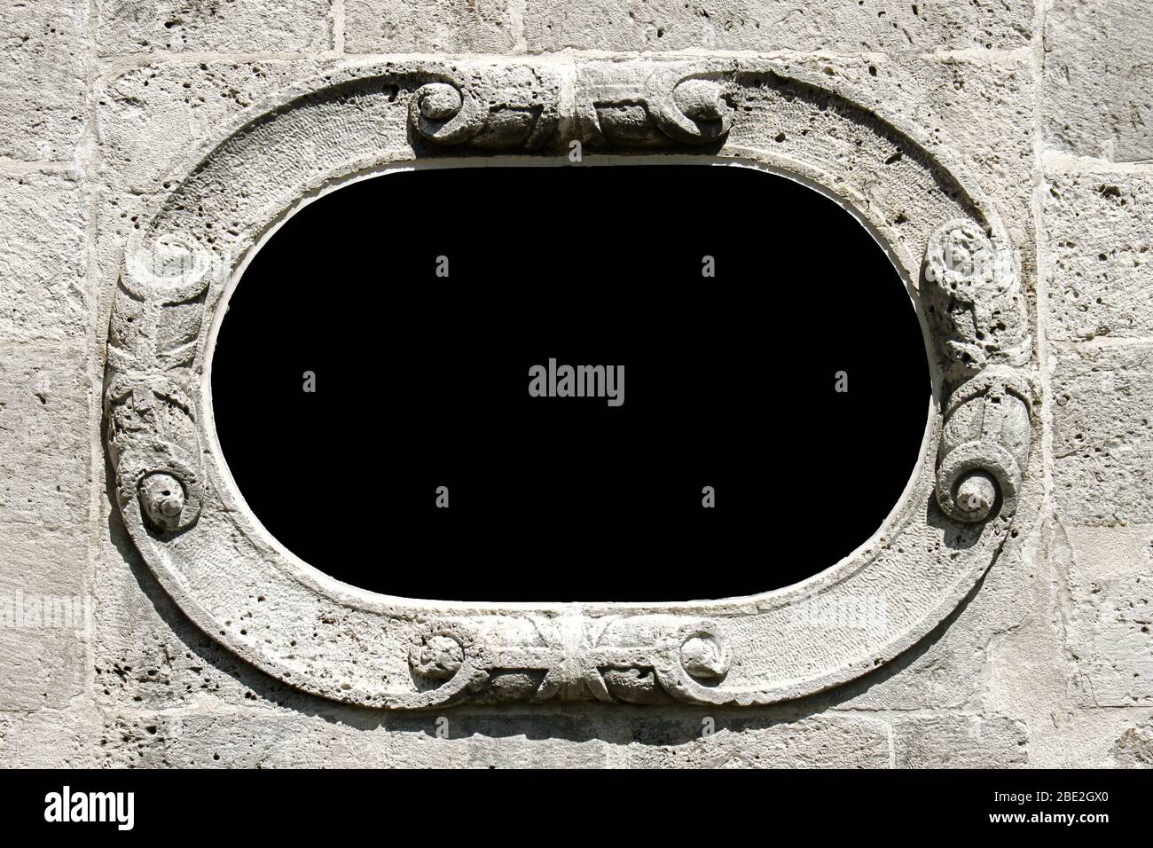 Old an ancient round stone window on very old house in Perast ...