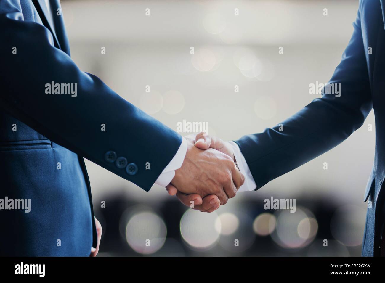 successful contract negotiate and handshake concept, two businessman ...