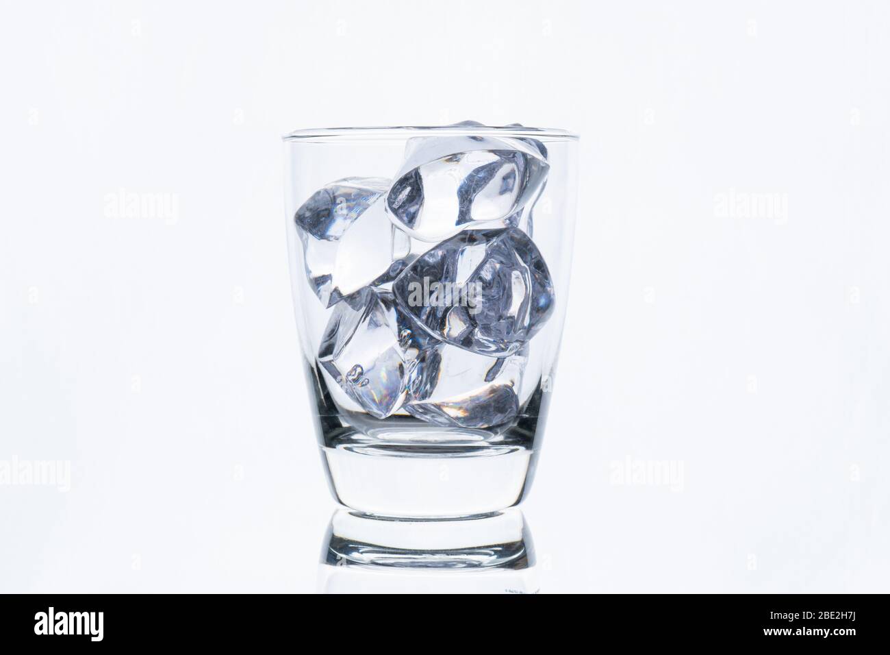 glass with ice cube isolated on white background Stock Photo - Alamy