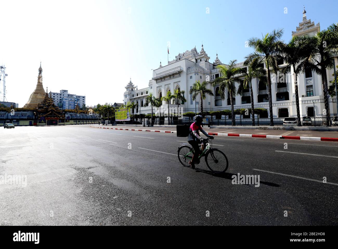 Yangon, Myanmar. 11th Apr, 2020. A food deliveryman rides in downtown Yangon, Myanmar, April 11 ...