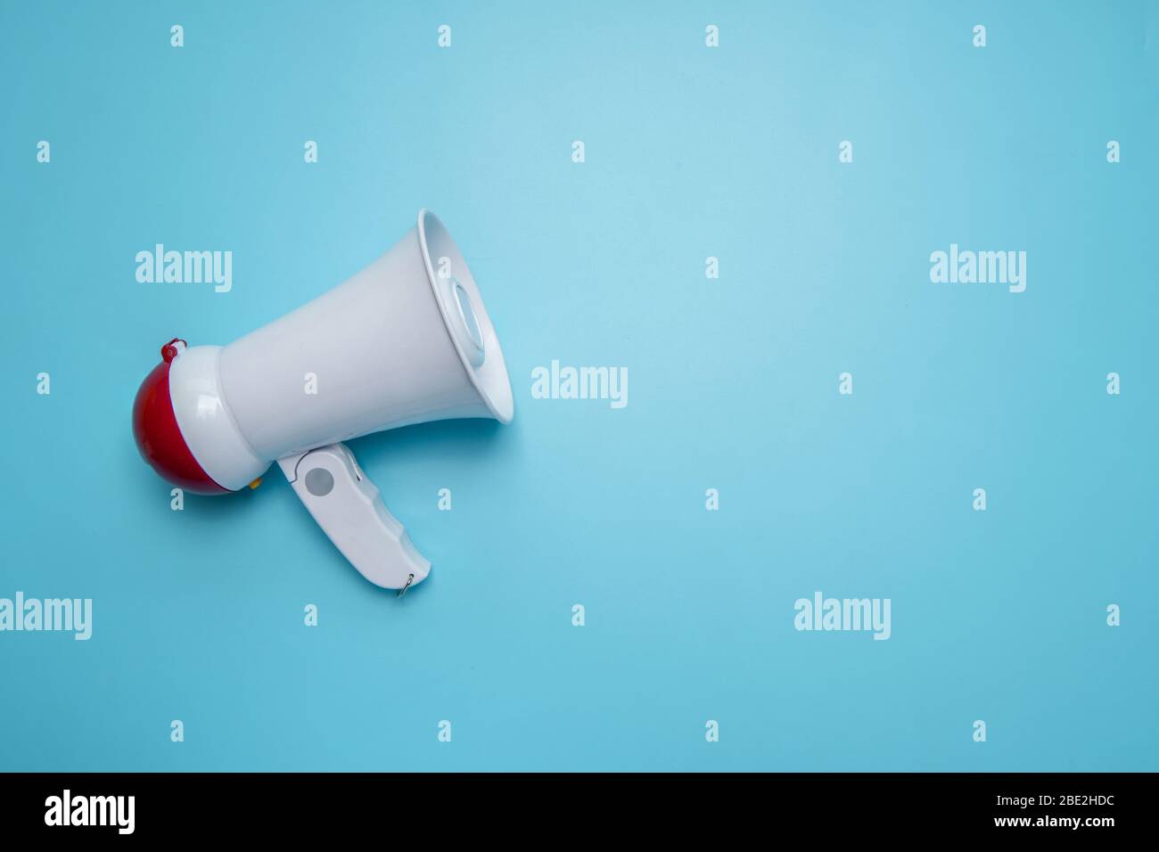 Megaphone announcement on blue background with copy space Stock Photo ...