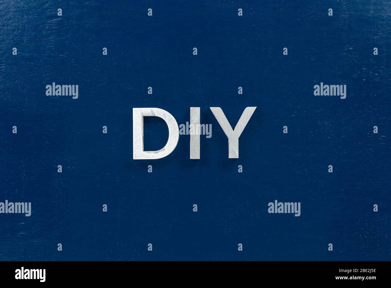 the abbreviation diy - do it yourself - laid with aluminium letters ...