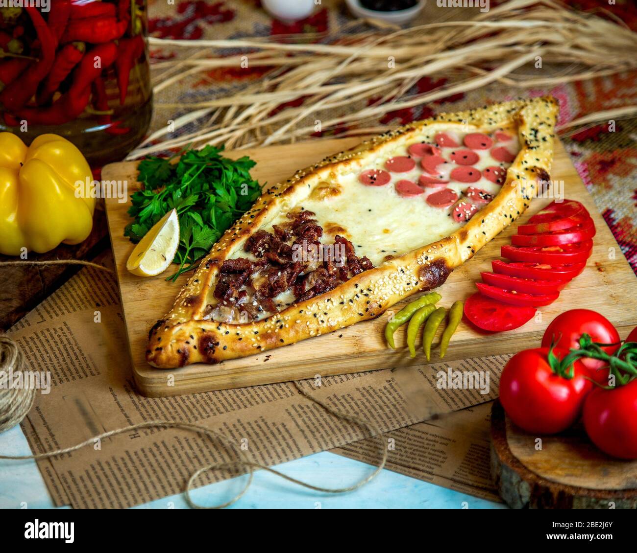 turkish pide with meat sausage and cheese Stock Photo - Alamy