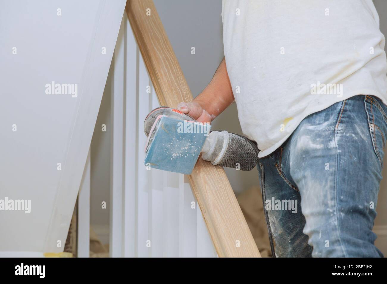 A wooden staircase renovation railing sandpaper sanding for wooden ...