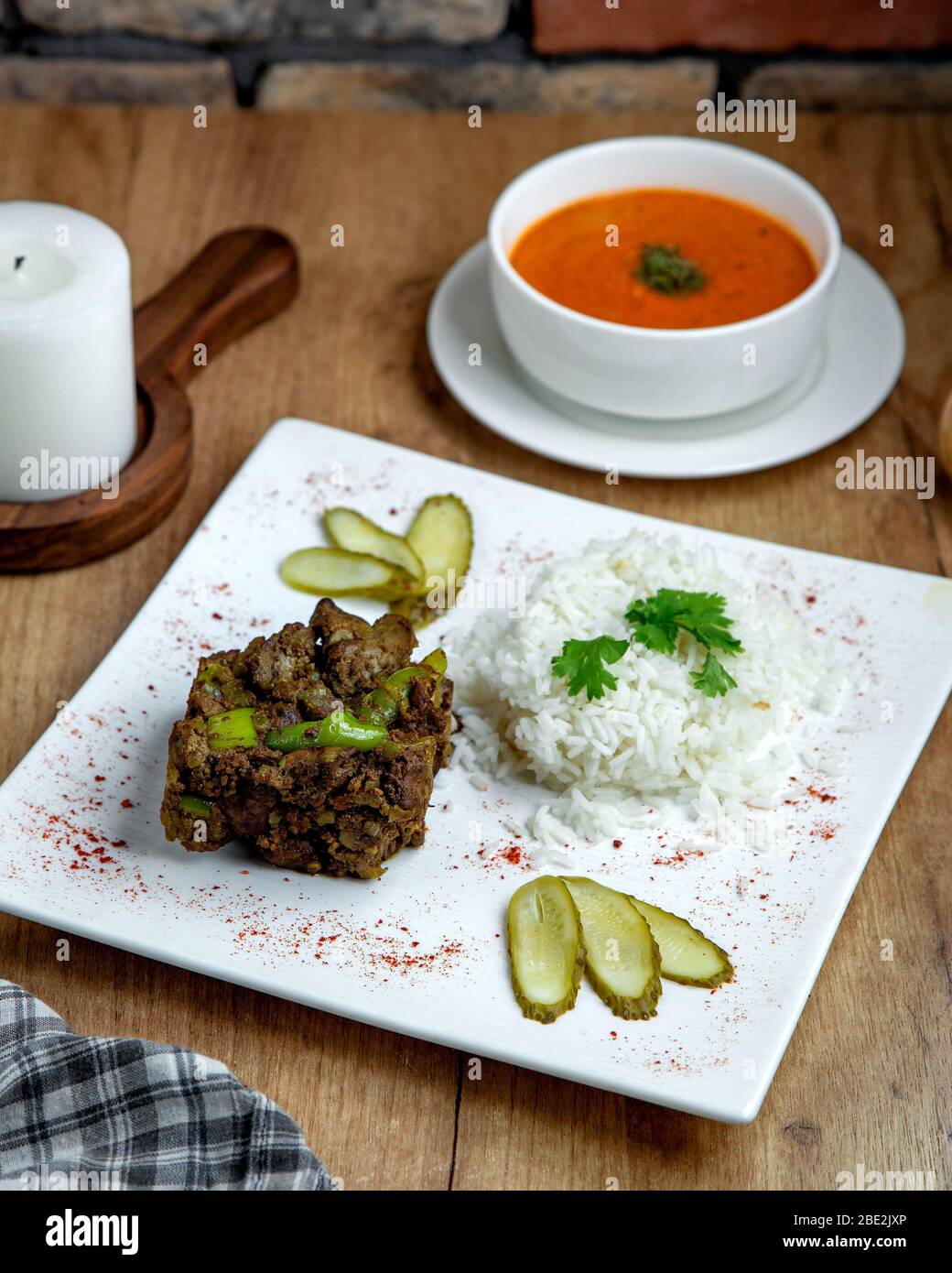 a plate of rice dish served with meat and herb mixture Stock Photo - Alamy