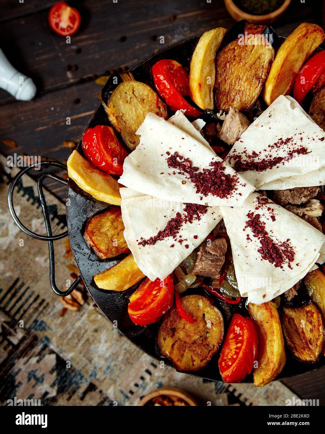 classic azerbaijani saj with grilled meat, tomatoes, eggplants, pepper ...