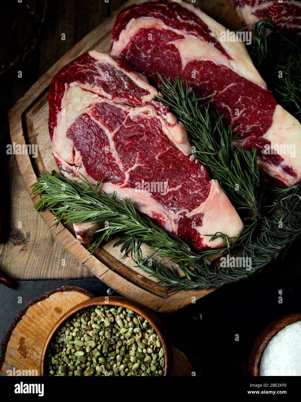 fresh rib eye steaks on the table Stock Photo - Alamy