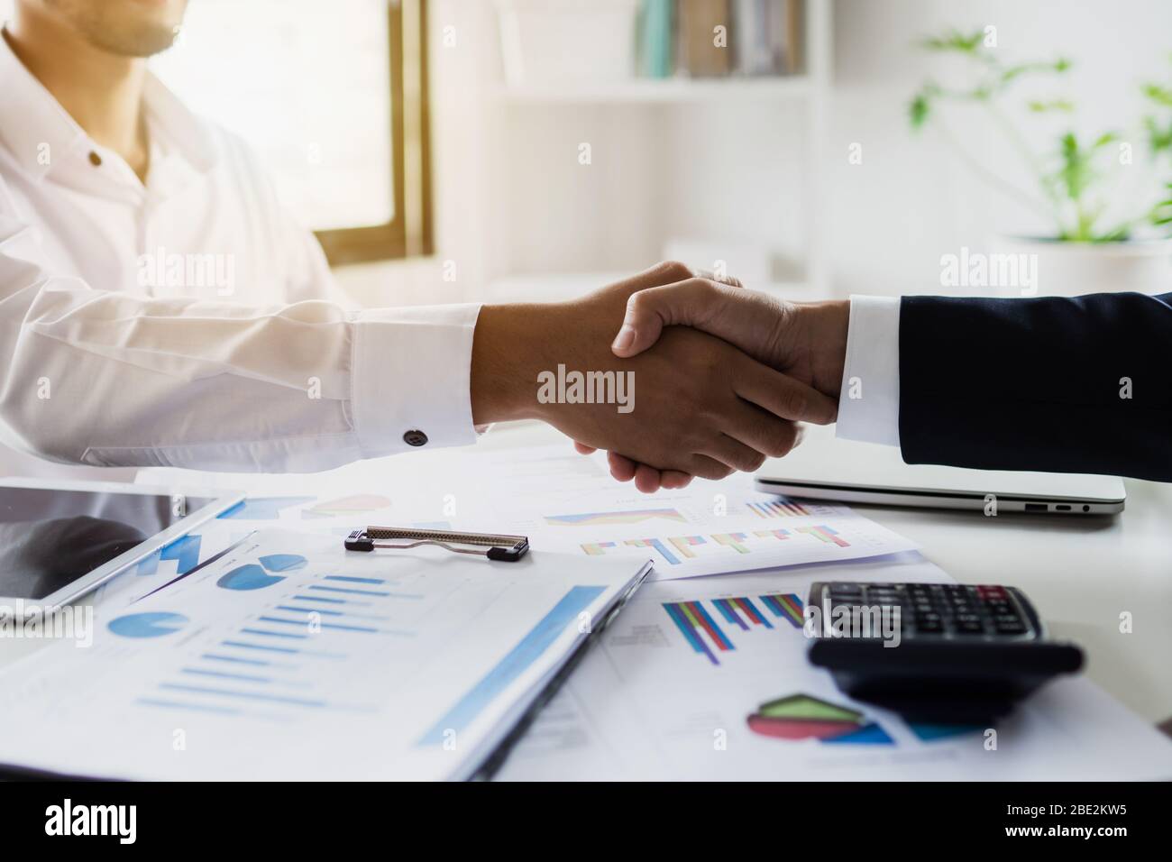 business people negotiate and shake hands with investor partner after ...