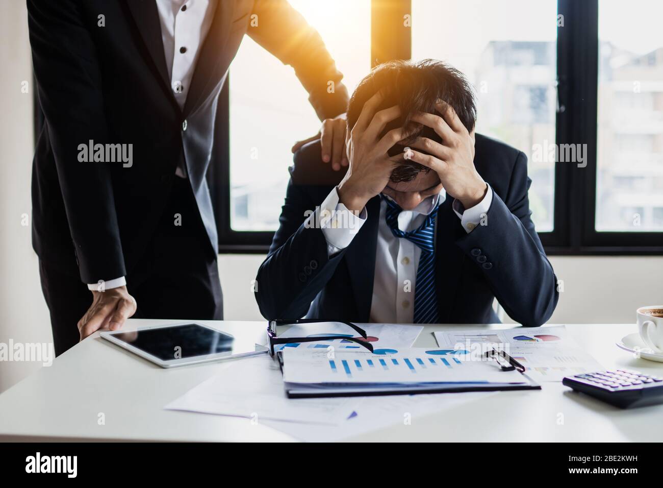 Manager or workmate encourage and talking with businessman who has tied ...