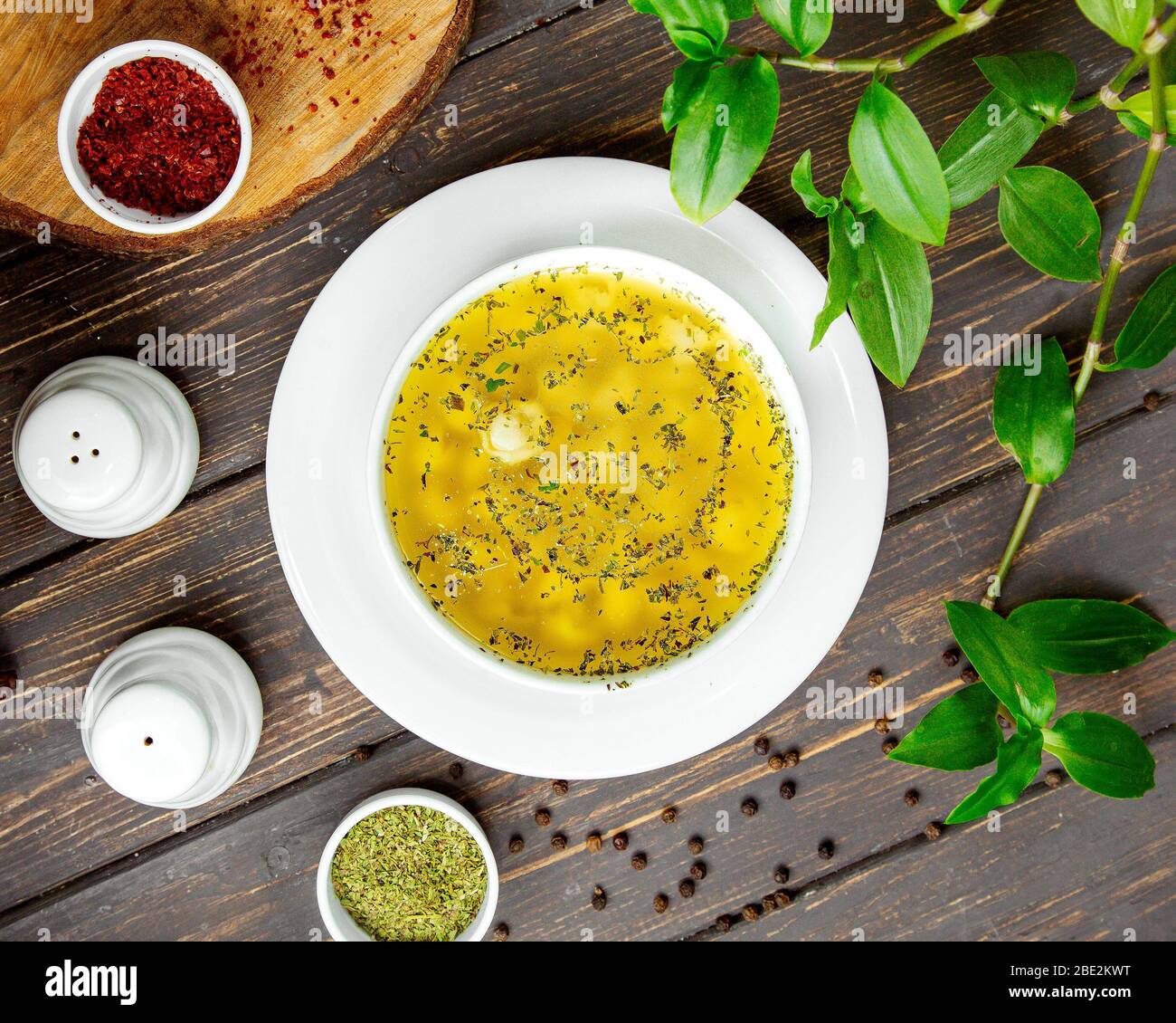 top view of dushbara dumpling soup with dried mint leaves Stock Photo ...
