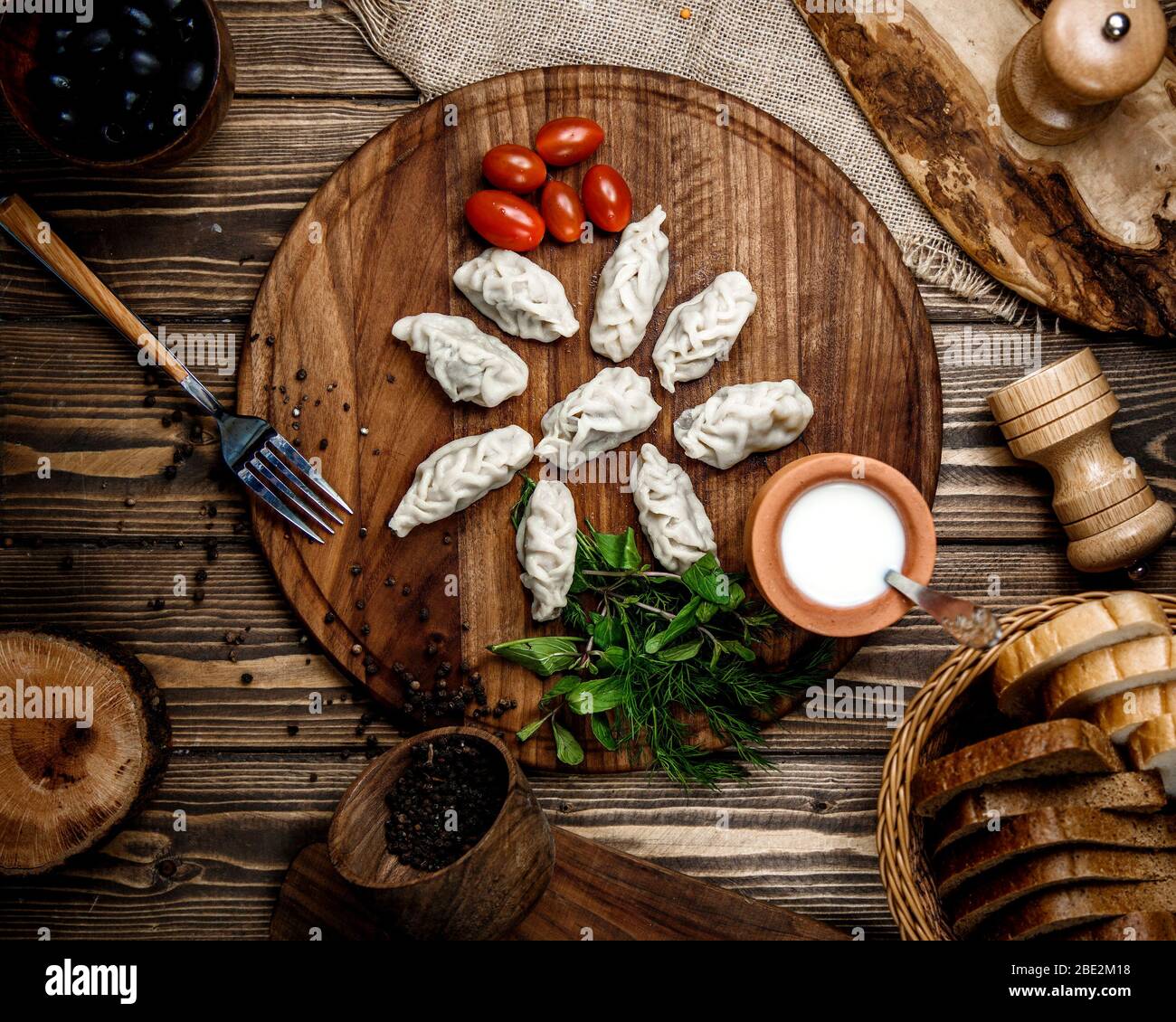 top view of gurza dumpling served with yogurt cherry tomato Stock Photo ...