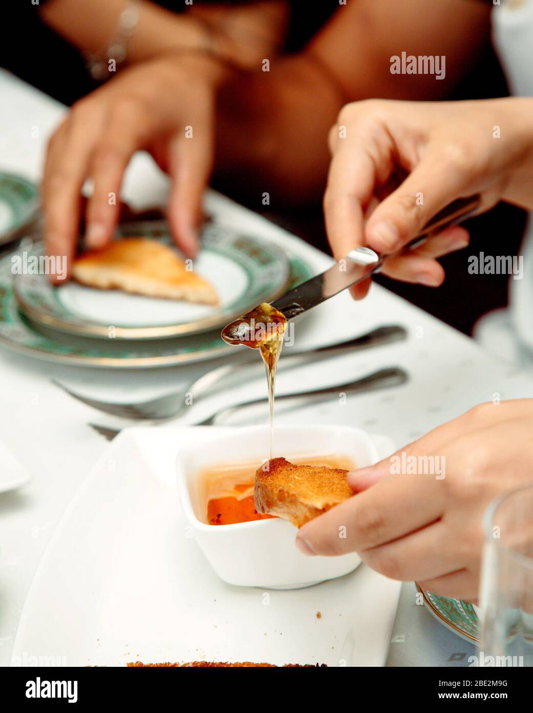Woman eating honey toast hi-res stock photography and images - Alamy