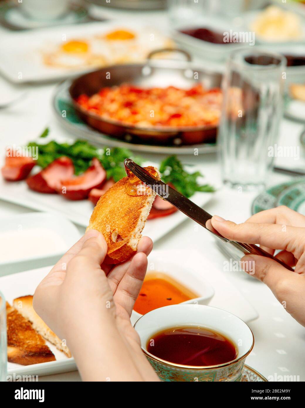Woman eating cheese on toast hi-res stock photography and images - Alamy