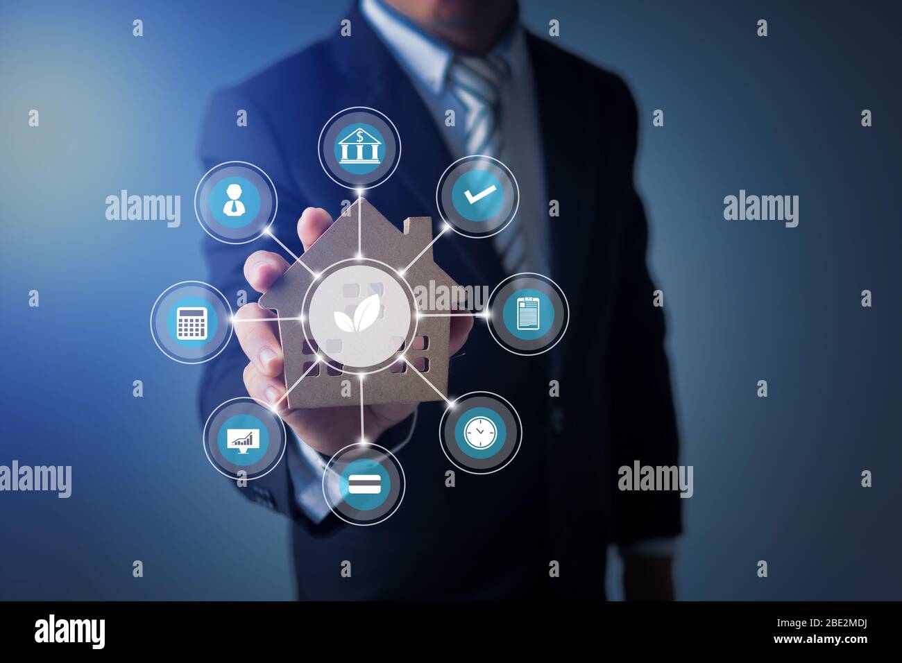 Businessman show smart home model and building with responsible for the ...