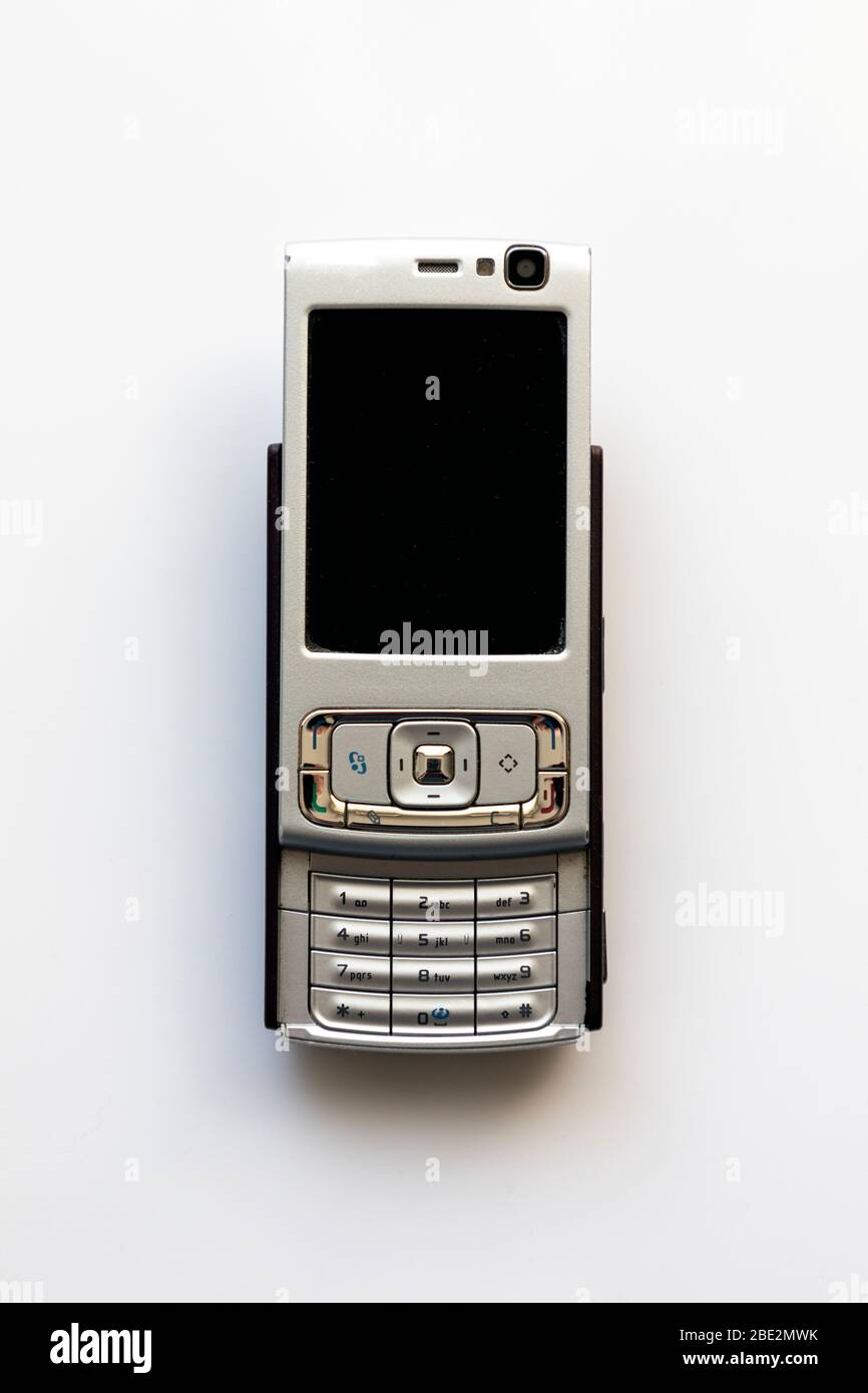 Old cell phone on the white background. An old, vintage mobile cell ...
