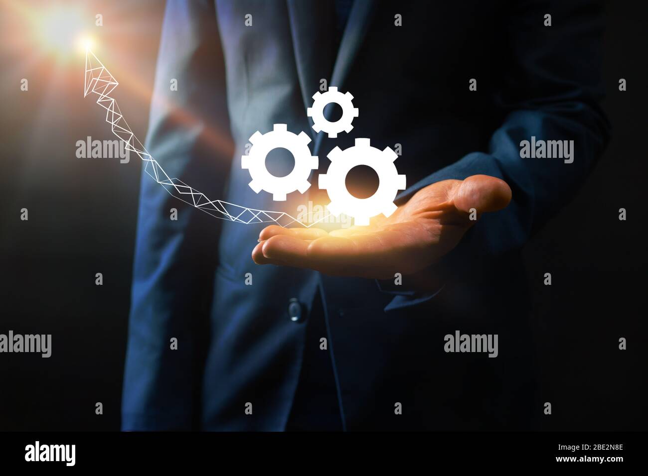 businessman holding cogs working and arrow up to success Stock Photo ...