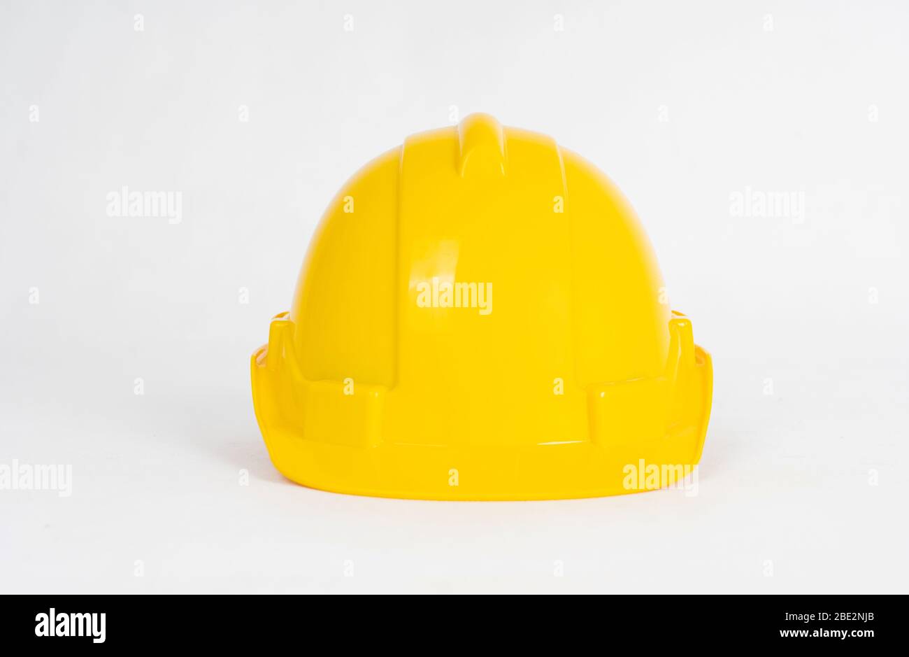yellow construction helmet isolated on white background Stock Photo - Alamy