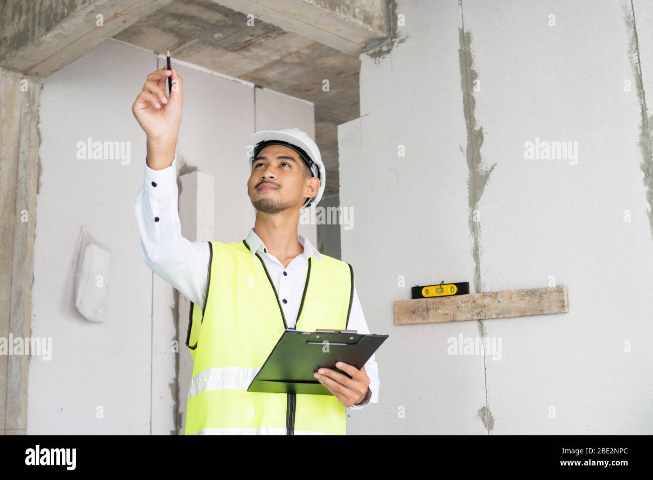inspector checking infomation paper of construction materials in ...