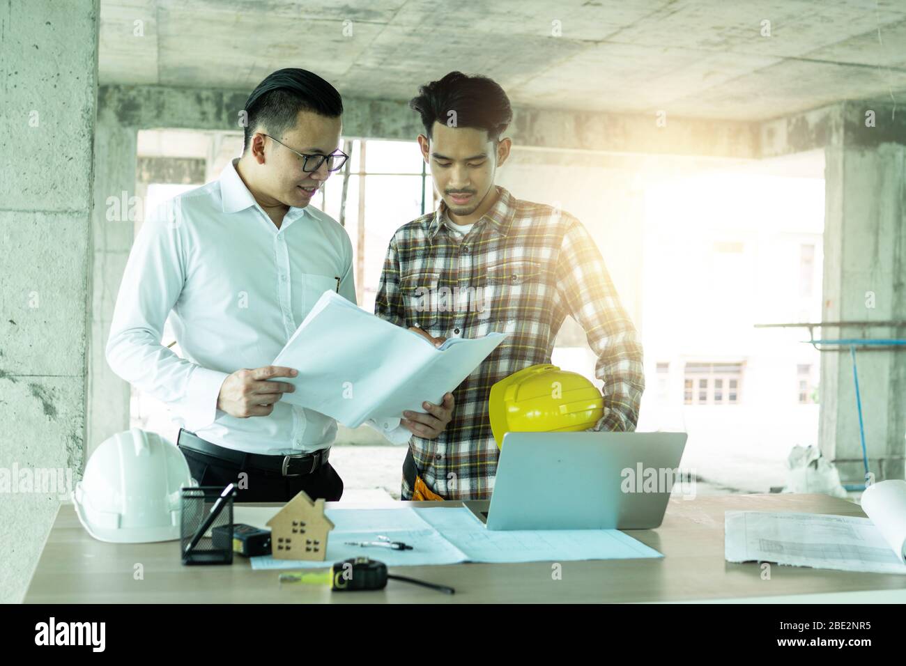 professional engineer planning with team young architect with laptop on ...