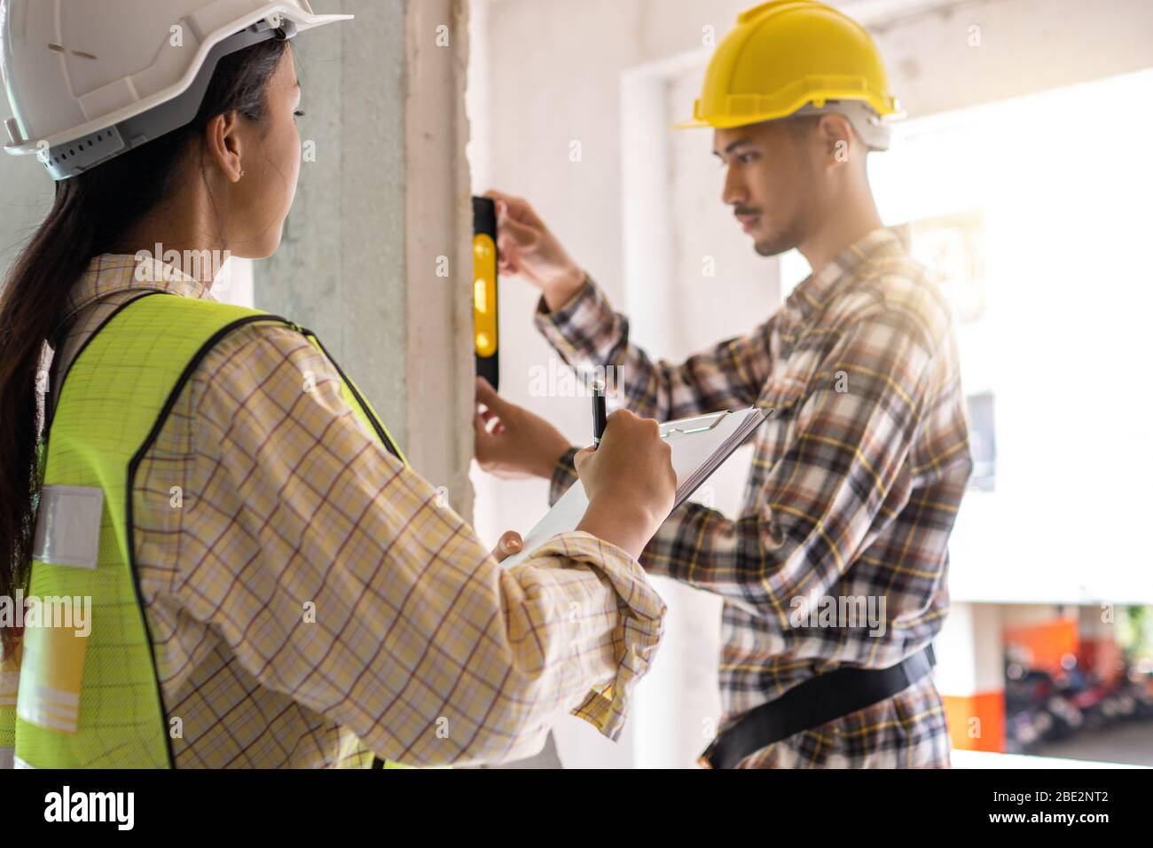 Team of Inspector holding clipboard opening paper and checking building ...