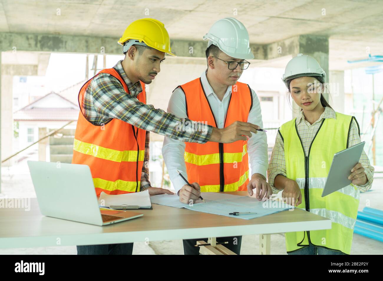 professional engineer planning with team young architect with laptop on ...
