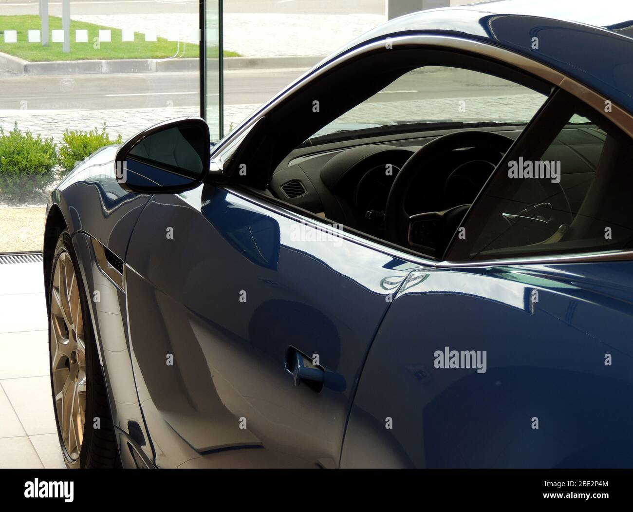 New Blue Vehicle Exposed In A Dealership Stock Photo - Alamy