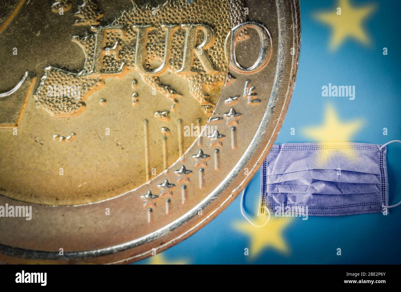 2 Euro coin with a face surgical mask Stock Photo - Alamy