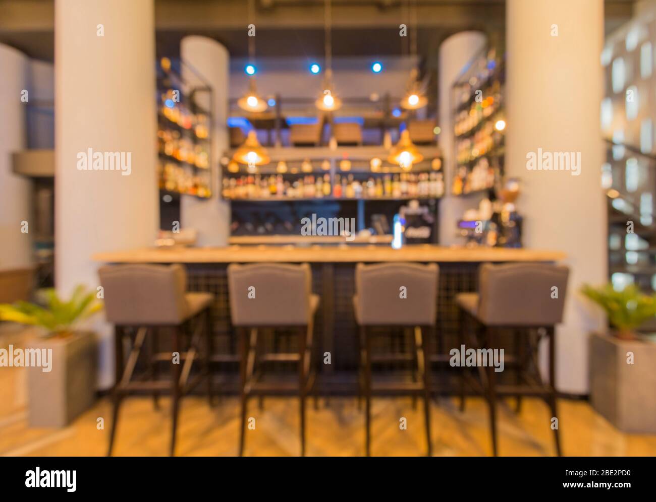 Half-lighted hall in a loft style in urban cafe with open bar Stock ...