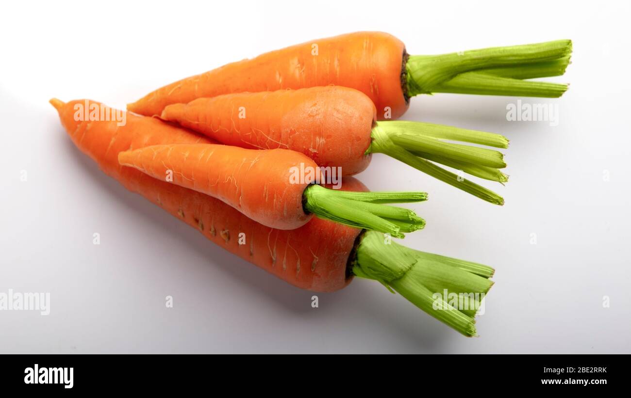 Whole clean fresh carrots on white background with shadow Stock Photo ...