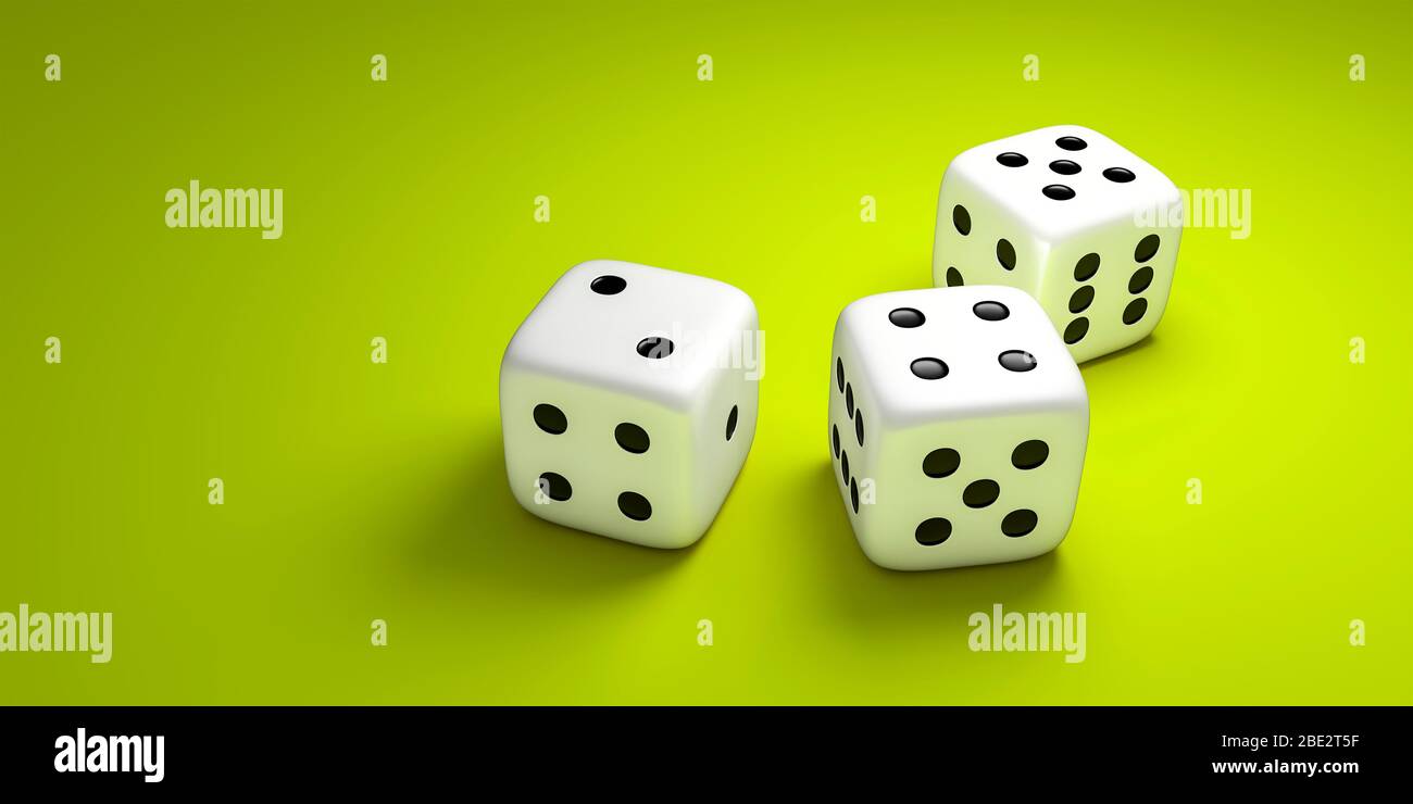 three dice on a green background Stock Photo - Alamy