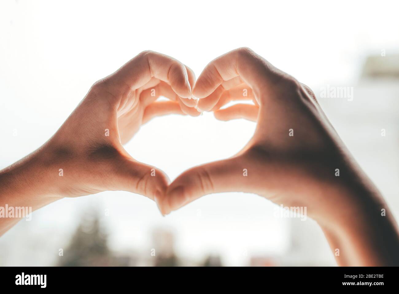 Female hands in the form of heart Stock Photo - Alamy