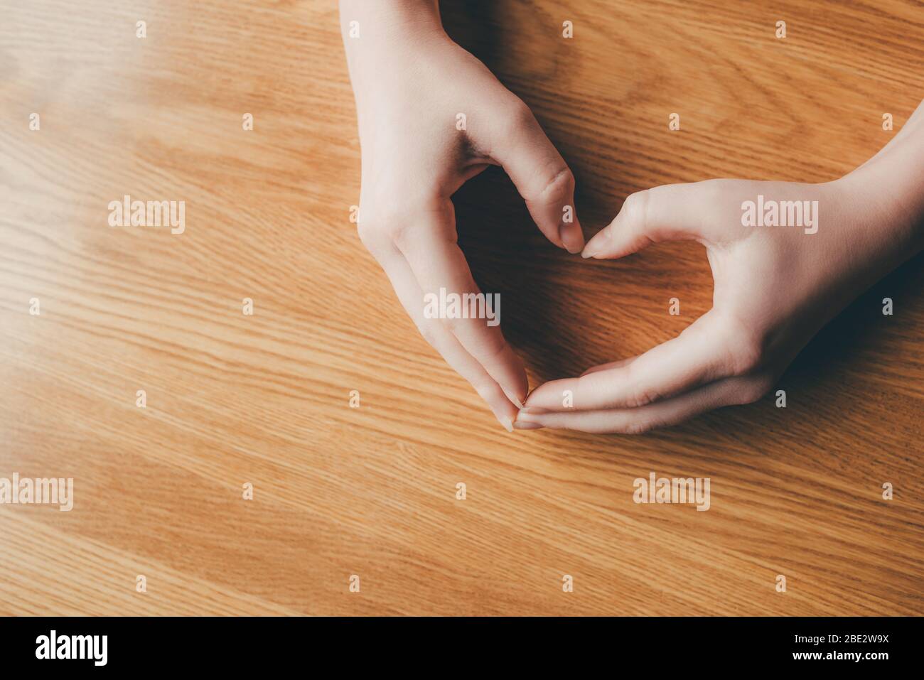 One hand heart shape sun hi-res stock photography and images - Alamy