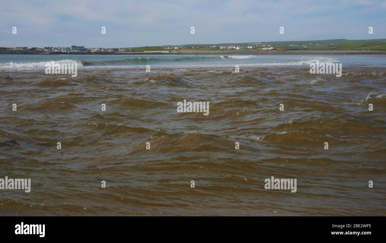 Where a river meets the sea. The tidal shift of water moving around the ...